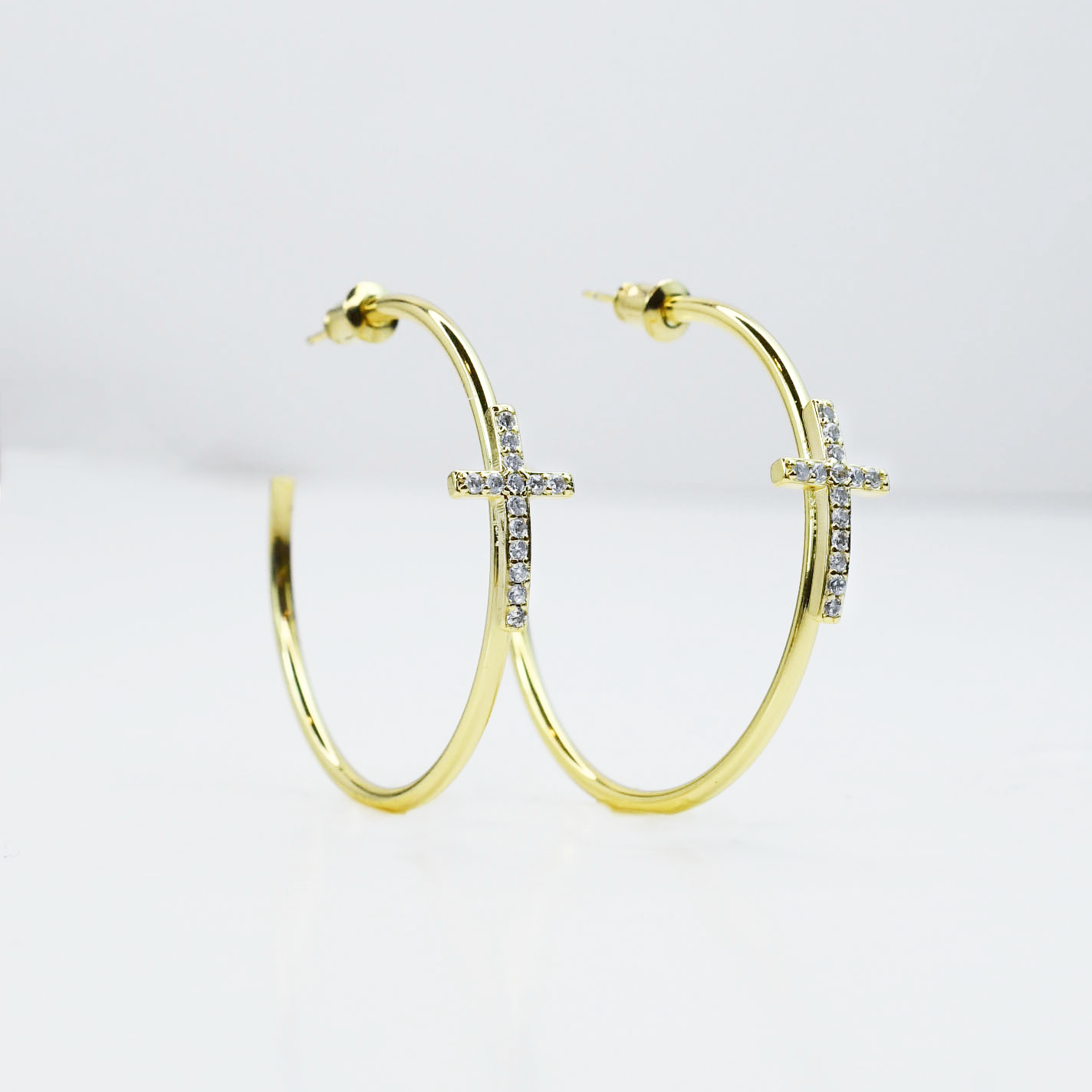 Golden Crossed Grace Hoops. – Treasure Jewels, Inc.
